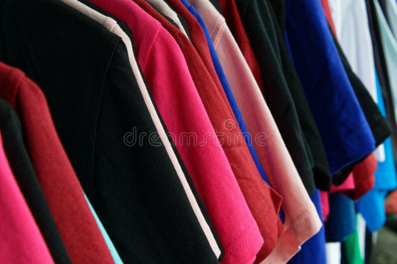 A Row of Different Coloured Shirts Stock Image - Image of clothing ...