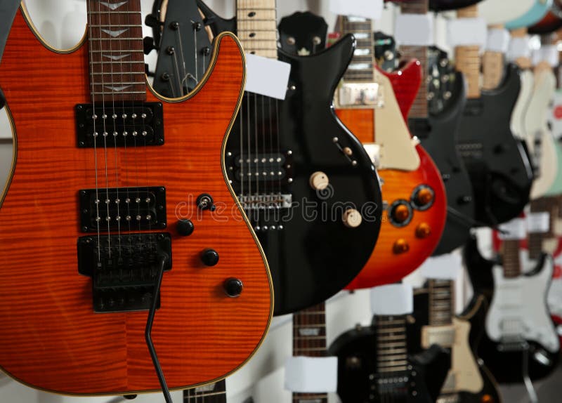 Row of Different Guitars in Music Store Stock Photo - Image of choice ...