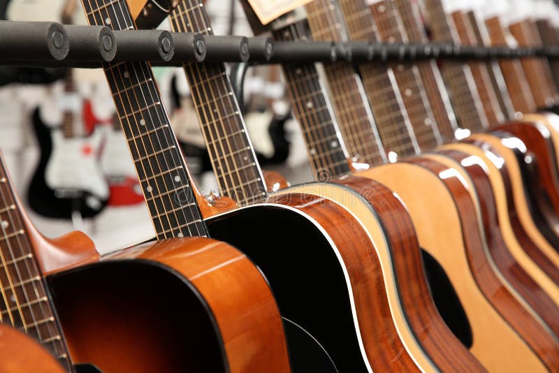Row of Different Guitars in Music Store Stock Photo - Image of play ...