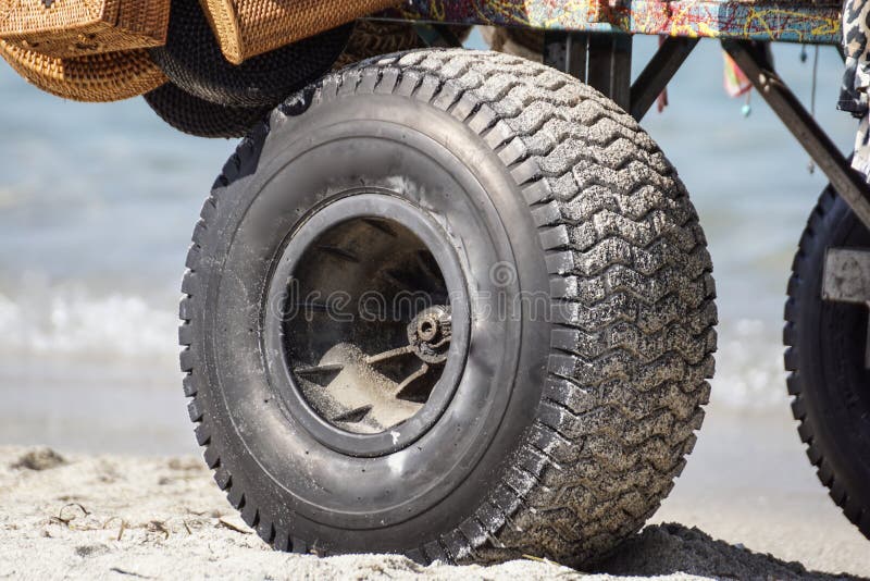Row of Dinghy Sailing Wagon Wheels on Sand. Stock Image - Image of safe ...