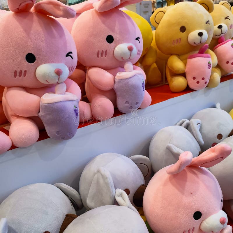 A Row of Dolls Arranged on a Shelf in a Toy Store Supermarket Stock ...