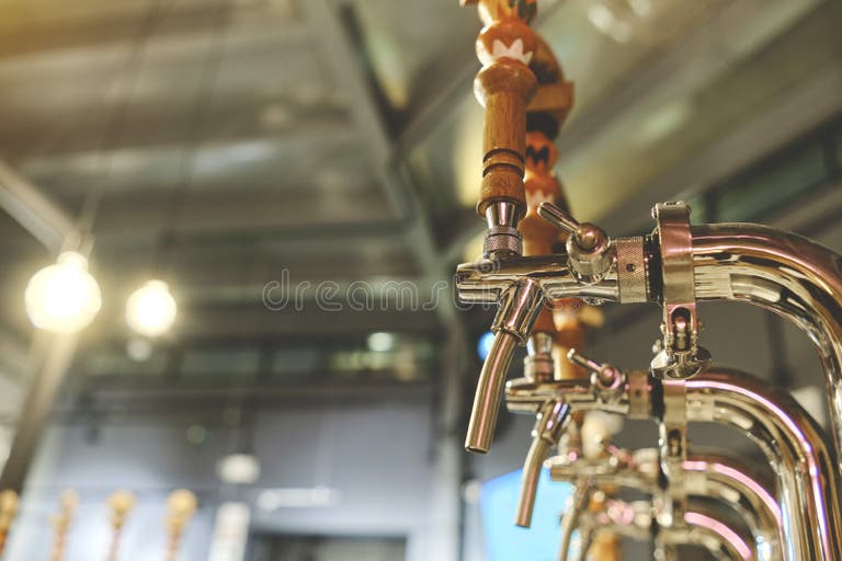 Row of Draft Beer Taps at a Bar. Beer Taps in a Row in Perspective ...