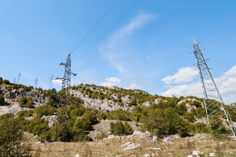Row of Electrical Power Lines in the Mountains among the Forest Stock ...