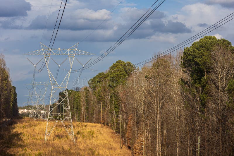 Row of Electricity Transmission Towers Lined Up in Residential ... Row of Electricity Transmission Towers Lined Up in Residential ...