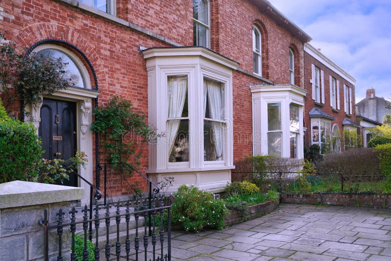 Brick Townhouses with Bay Windows Stock Photo - Image of england ...
