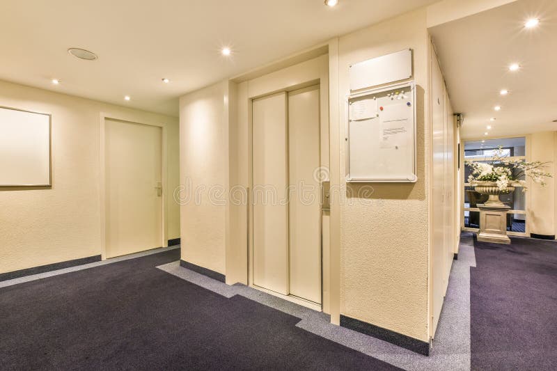 A Row of Elevators in a Room with Carpet Stock Image - Image of ...