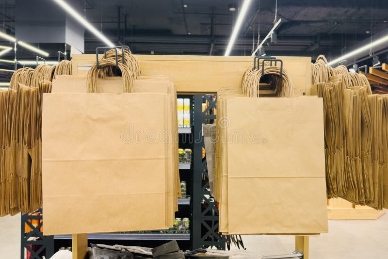 Row of Empty Brown Paper Bags Hangs on a Hanger in the Store Stock ...