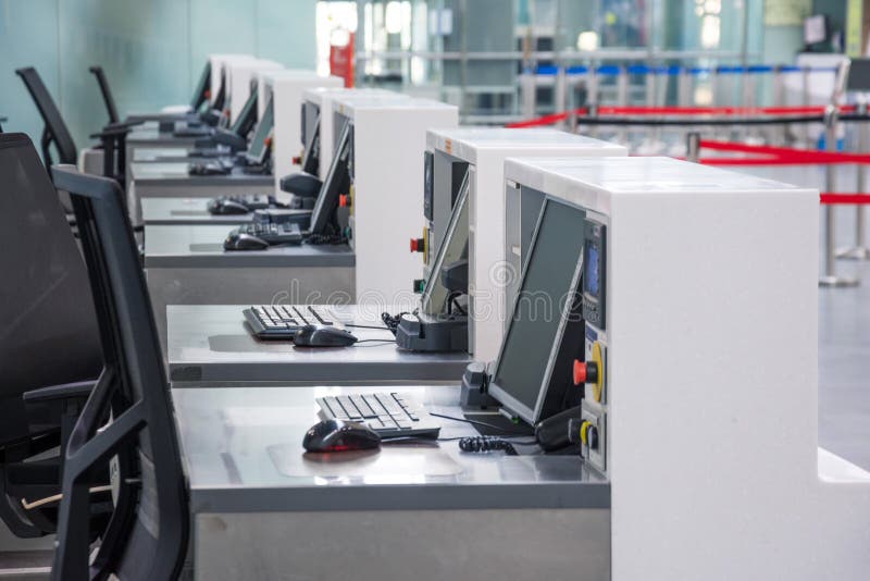 Row of Empty Check-in Desks with Computer Monitors at the Airport Stock ...
