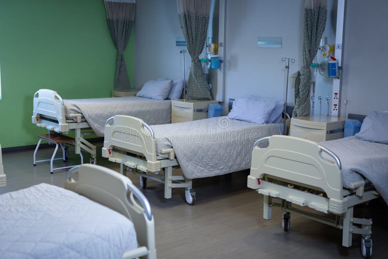 Row of empty hospital beds stock photo. Image of room - 143813594