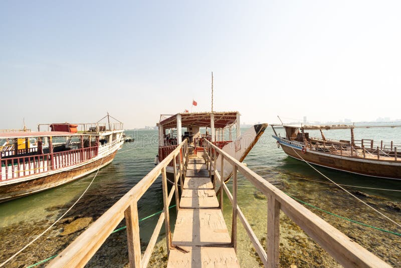 Row of Empty Old Traditional Dhow Ships Docked by the Shore at Doha ...