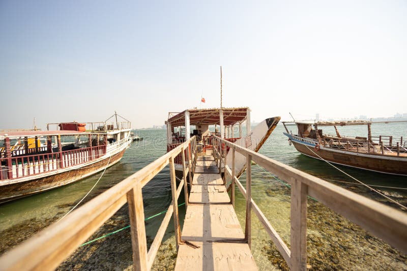 Row of Empty Old Traditional Dhow Ships Docked by the Shore at Doha ...