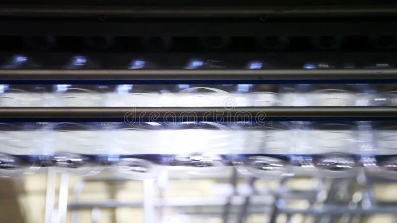 Plastic Bottles are Automatically Filled with Liquid. Stock Footage ...