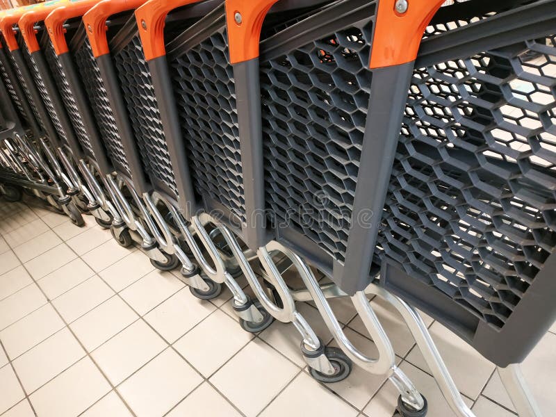 Row of Empty Shopping Carts in the Big Supermarket Stock Image - Image ...