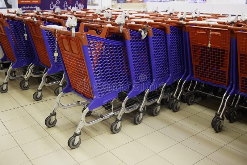 Row of Empty Shopping Carts in the Big Supermarket Stock Image - Image ...