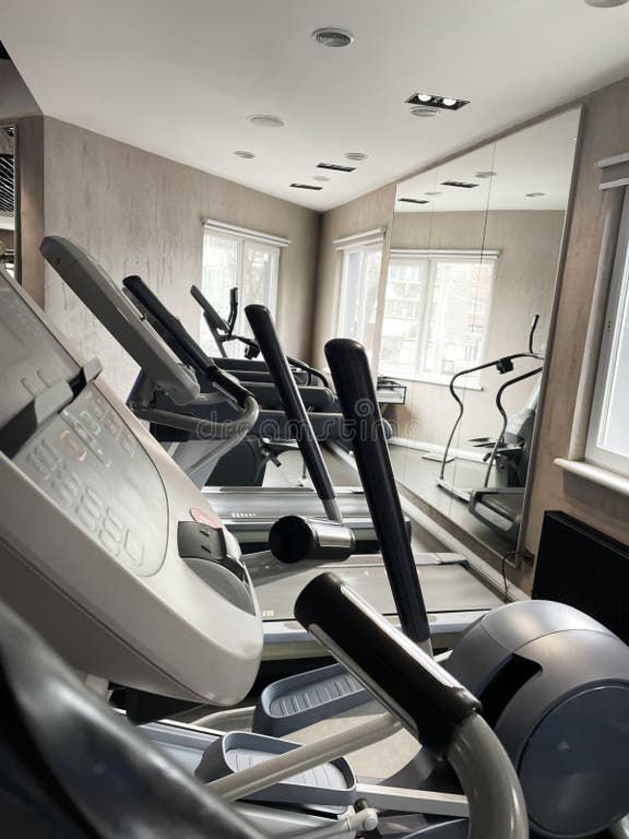 Row of Exercise Machines Treadmills in a Bright Room Stock Photo ...