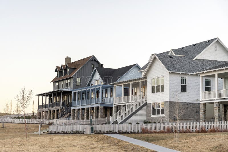 Row of Fenced Residential Buildings with Different Architectural ...