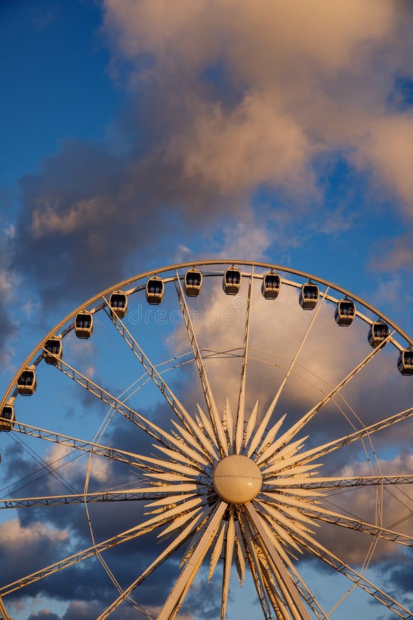 The Row of Ferris Wheel Cabins Against the Backdrop of Beautiful Sunset ...