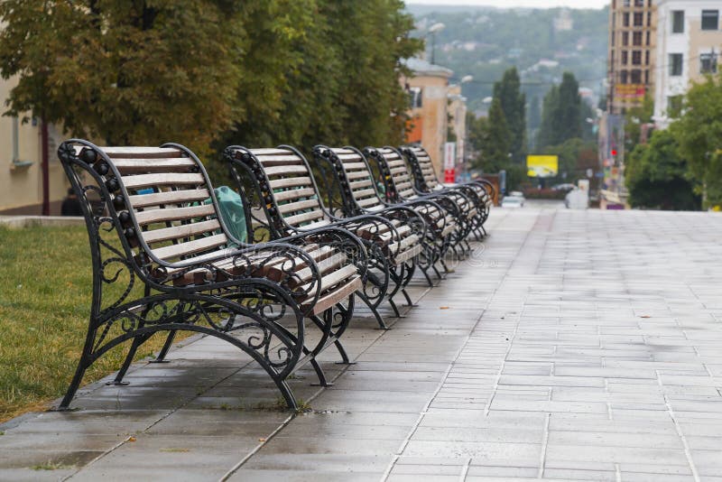 A Row from Five Benches on the Street Stock Image - Image of benches ...