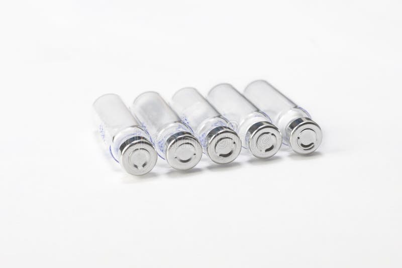 Vials with Medication and Syringe on White Table. Top View. Medical ...