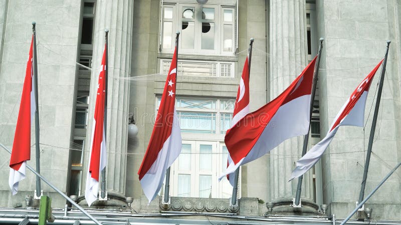 A Row of Flags are Flying Outside of a Building Editorial Image - Image ...