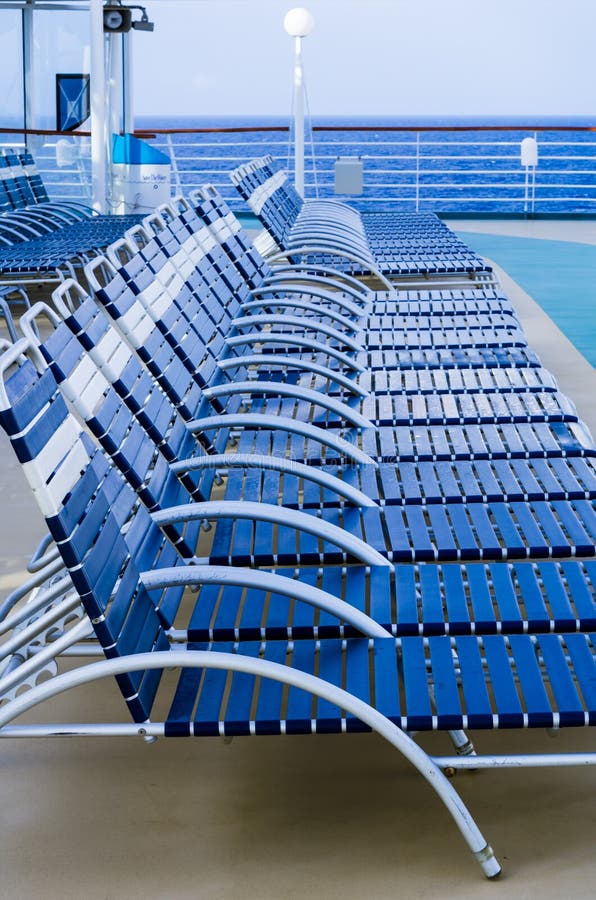 Row of Folding Lounge Chairs on Deck Stock Image - Image of leisure ...