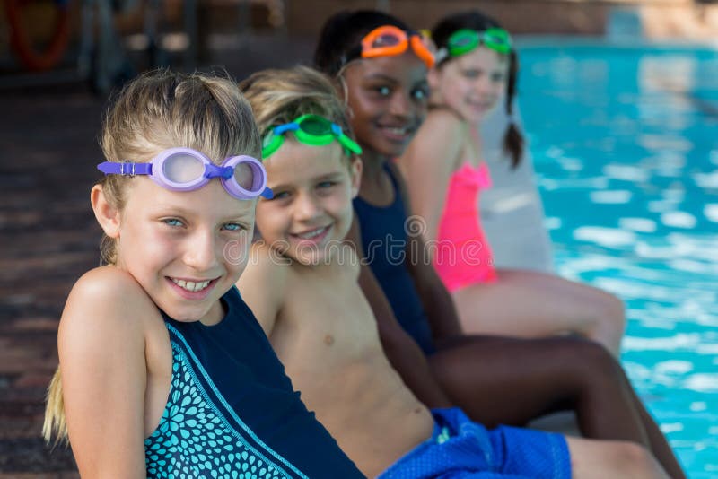 Row Of Friends Sitting At Pool Side Stock Image - Image of cute ...