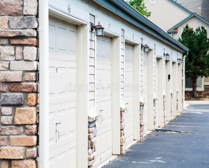 Row of Garage Doors stock photo. Image of suburbs, front - 40163076