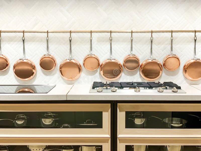 Row of Gleaming Copper Pans Hanging on the Wall Stock Image - Image of ...