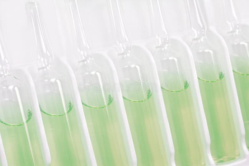 Row of green ampoules stock photo. Image of liquid, closeup - 13452798