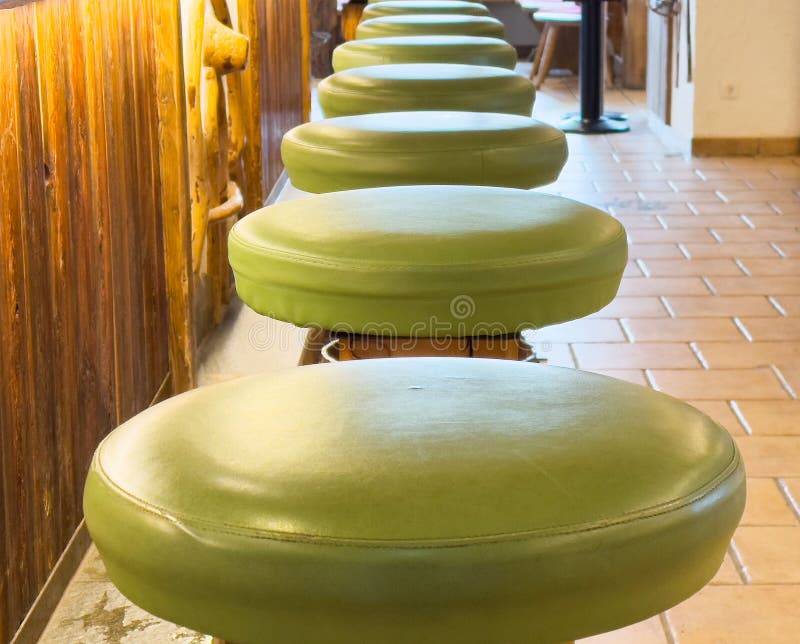 Row of Green Bar Stools in Rustic Indoor Setting with Tiled Floor, Cafe ...