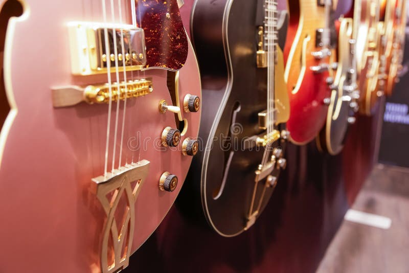 Row of guitars stock photo. Image of music, bridge, merchandise - 176955438