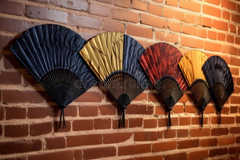 A Row of Hand Fans Hanging on a Line Against a Brick Wall Stock ...