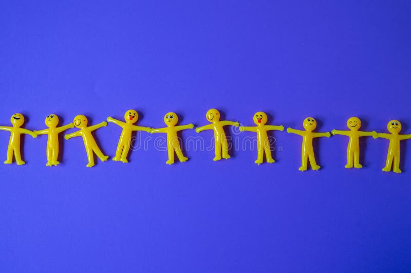A Row of Happy Yellow Figures Stock Image - Image of yellow, april ...
