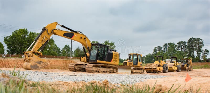 Heavy Construction Machinery in a Row at a Job Site. Stock Photo ...