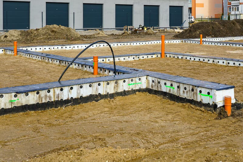Row House Construction Site with Prepared Concrete Foundations and ...