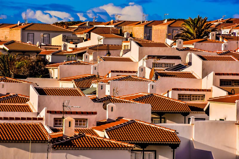 A Row of Houses with Red Roofs and White Walls Stock Photo - Image of ...