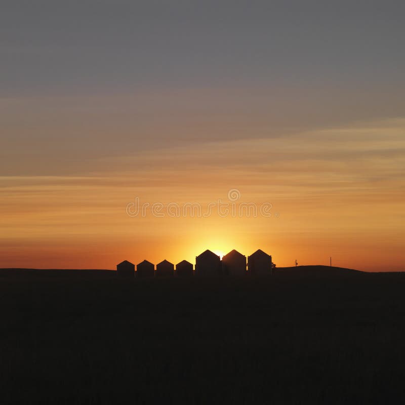 Row of Houses Silhouetted at Sunset Stock Photo - Image of background ...