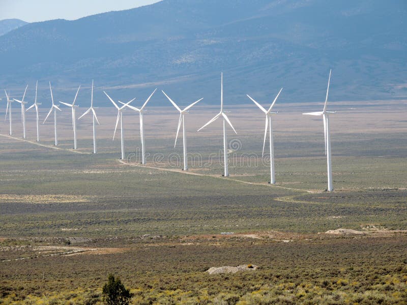 Row of Huge, White Wind Turbines in a Large Field Stock Photo - Image ...