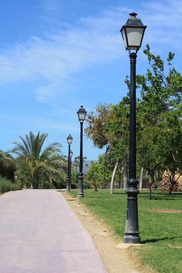 Row of lampposts in park stock image. Image of mediterranean - 18270339