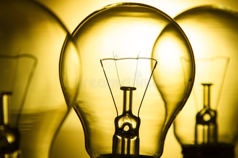 Row of Light Bulbs on a Bright Yellow Background Stock Photo - Image of ...