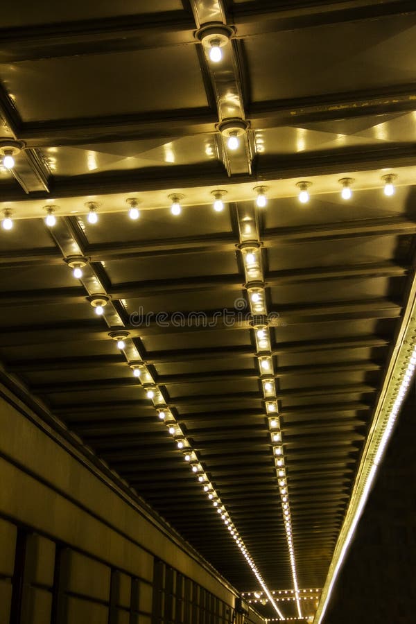 Row of Light Bulbs on a Ceiling at Night Stock Image - Image of city ...