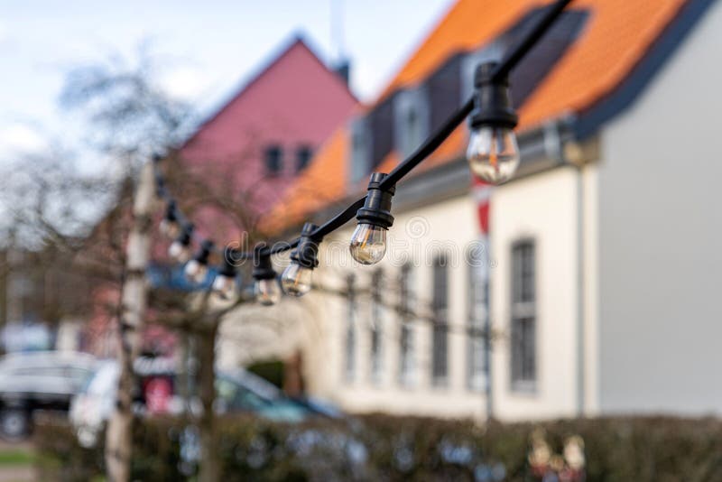 A Row of Lights Hanging from a Tree Stock Photo - Image of lantern ...