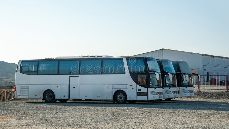 Row of Luxury Buses Parked on the Construction Site for Transporting a ...
