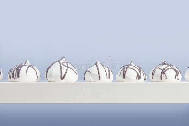 A row of meringue cakes stock image. Image of table, baking - 82107607