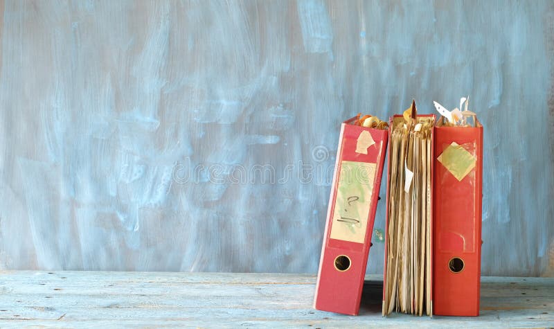 Row of Messy Old File Folders and Documents, Red Tape, Bureaucracy ...