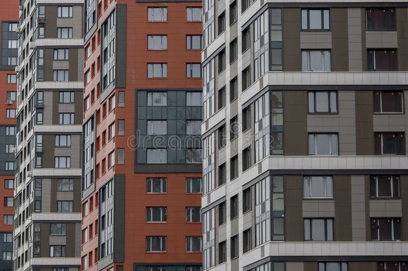 A Row of Modern Colored Multi-story Buildings with Close -up Windows ...