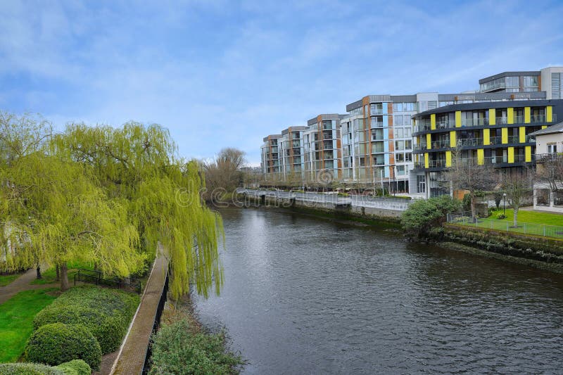 Row of Modern Low-rise Apartment Buildings beside a River Stock Image ...