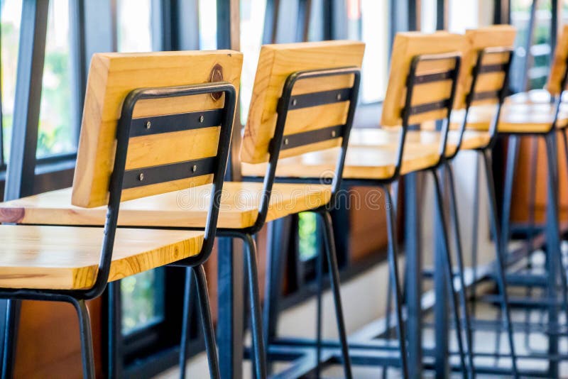 Row of modern wood chair stock photo. Image of restaurant - 208875192