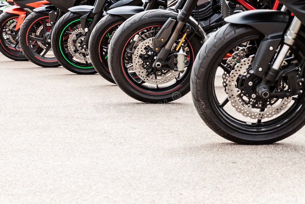 Row of motorcycle wheels stock image. Image of colorful - 46137389