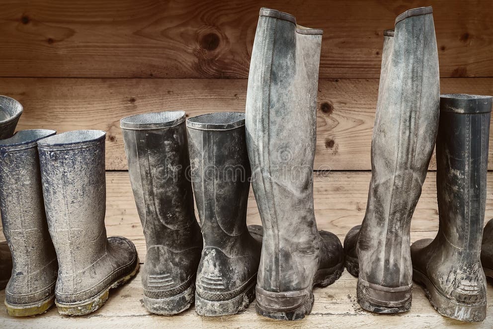 Row of muddy boots stock photo. Image of wood, muddy - 70650832